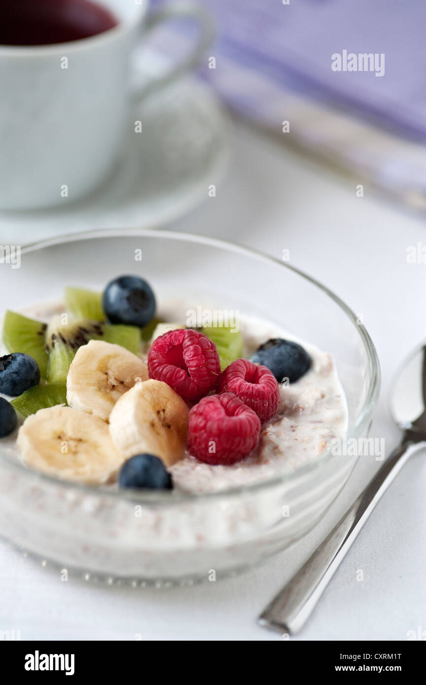 Fresh grain cereal with fresh fruit and a cup of tea Stock Photo - Alamy
