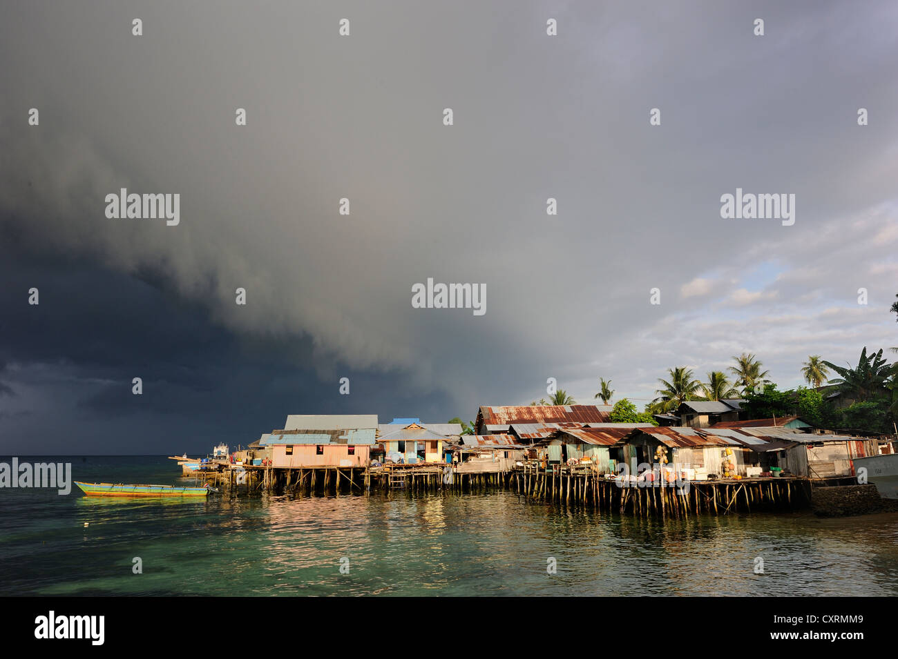 A storm front is hitting the coast at Kota Biak, Biak Island off the ...