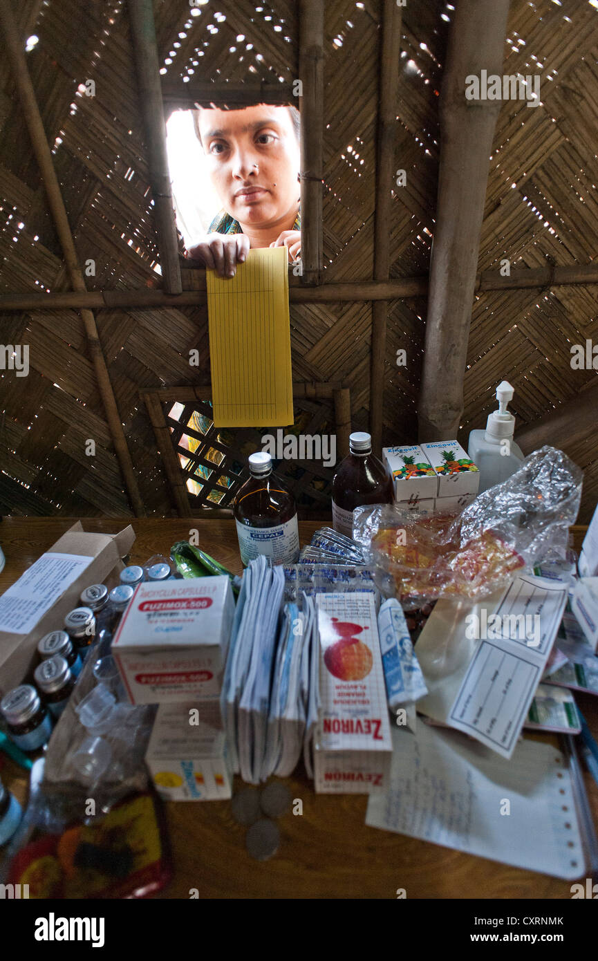 Woman at the medication dispatch window, clinic of the aid organistaion ...