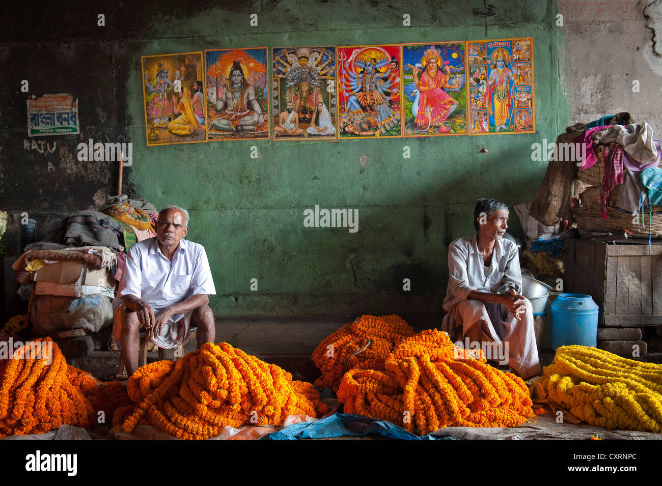 Images of Hindu gods on a green wall, flower market, Howrah Bride ...