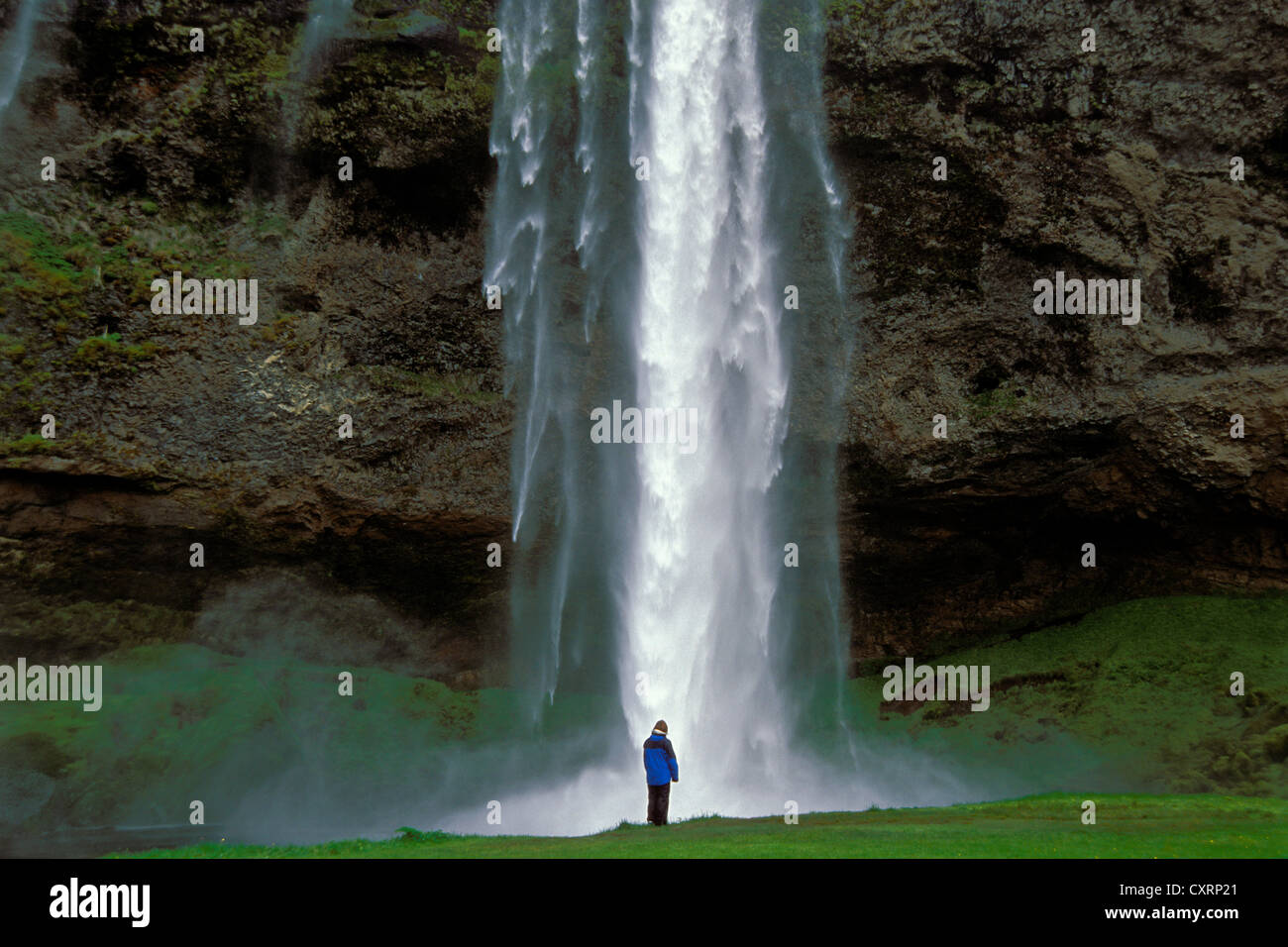 Person standing waterfall hi-res stock photography and images - Alamy