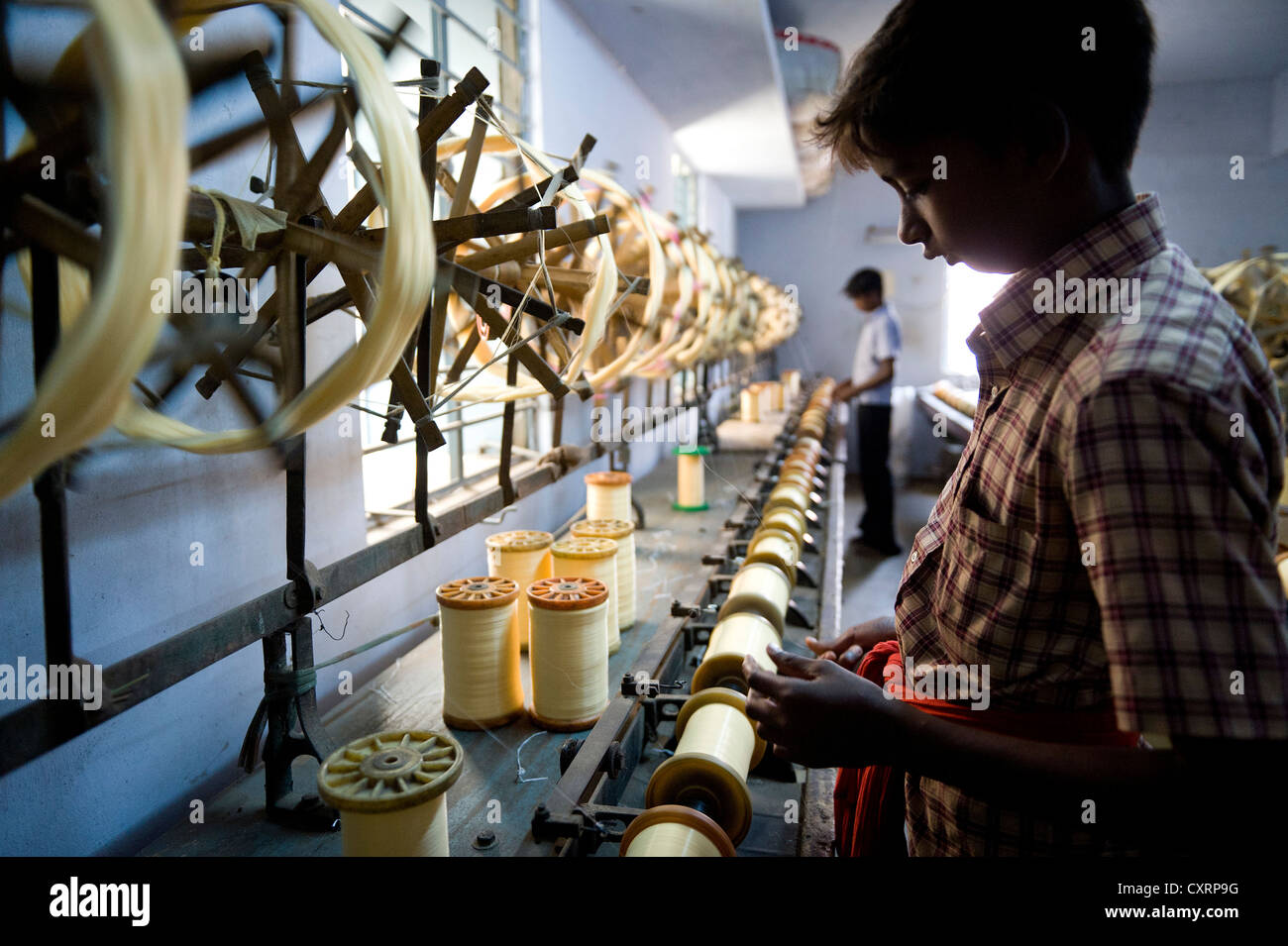 Child labourers working in a mosquito net factory, Karur, Tamil Nadu ...