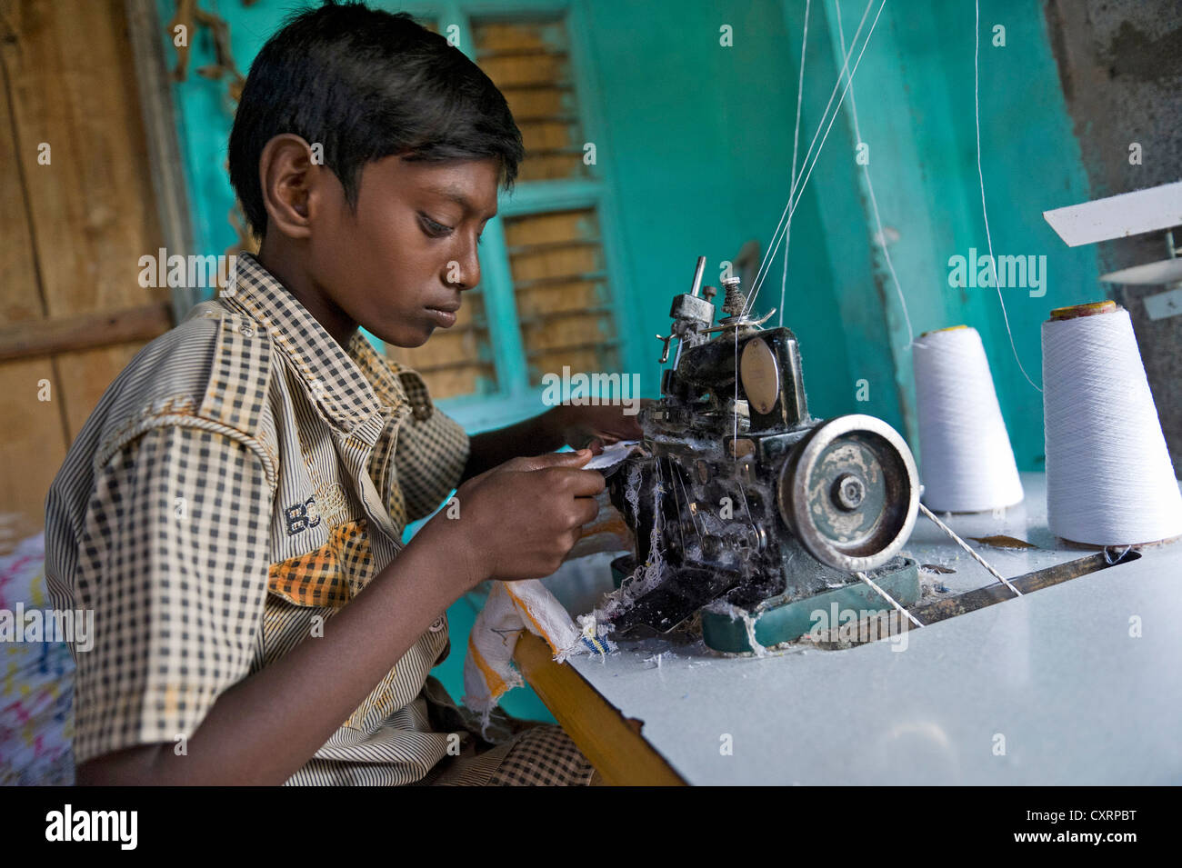 Boy, 14 years, working on a sewing machine, child labourer, Karur ...