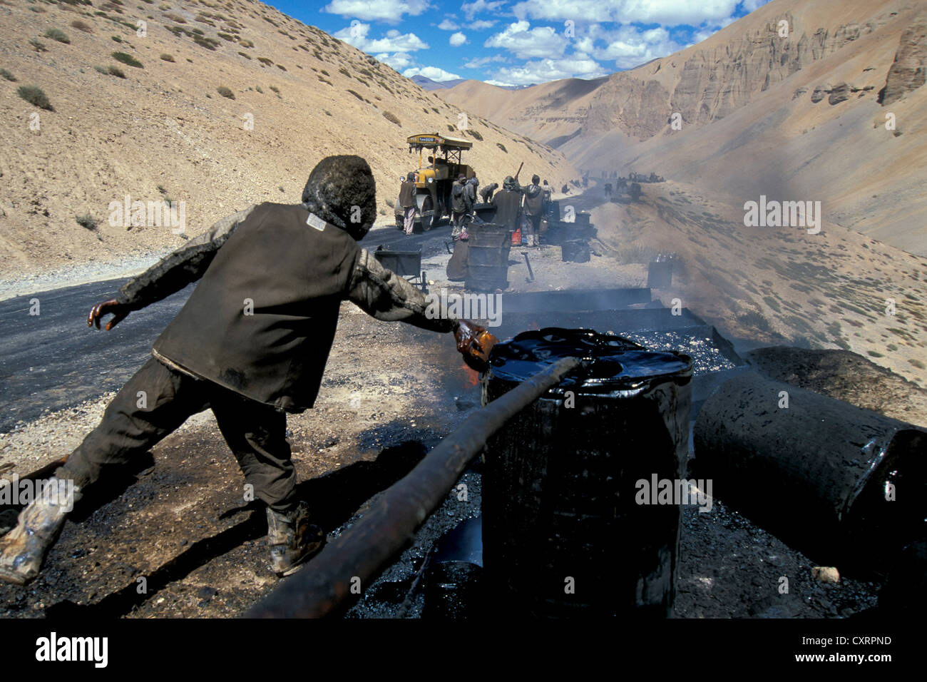 Road workers at the Manali Leh Highway, tarmacking a road at 5000m ...