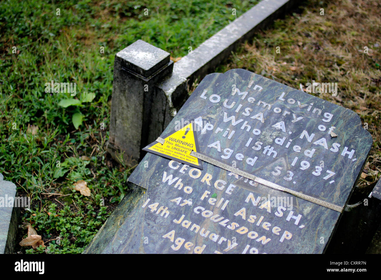 Warning sign on an unsafe headstone in Tottenham cemetery, London Stock ...