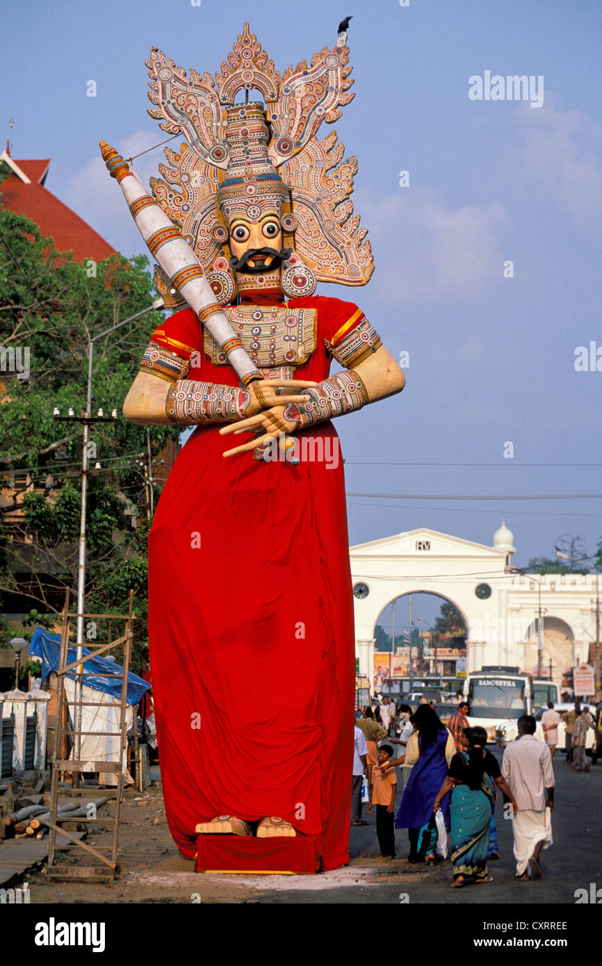 Red-clad guardian figure at the Hindu temple of Padmanabhaswamy ...