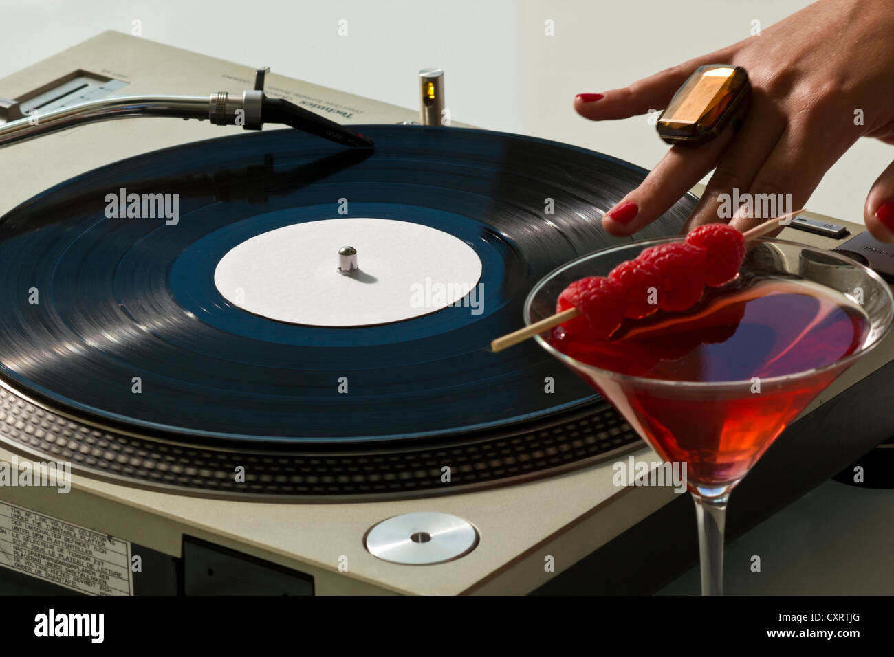 DJ Scratching with Cocktail Stock Photo - Alamy