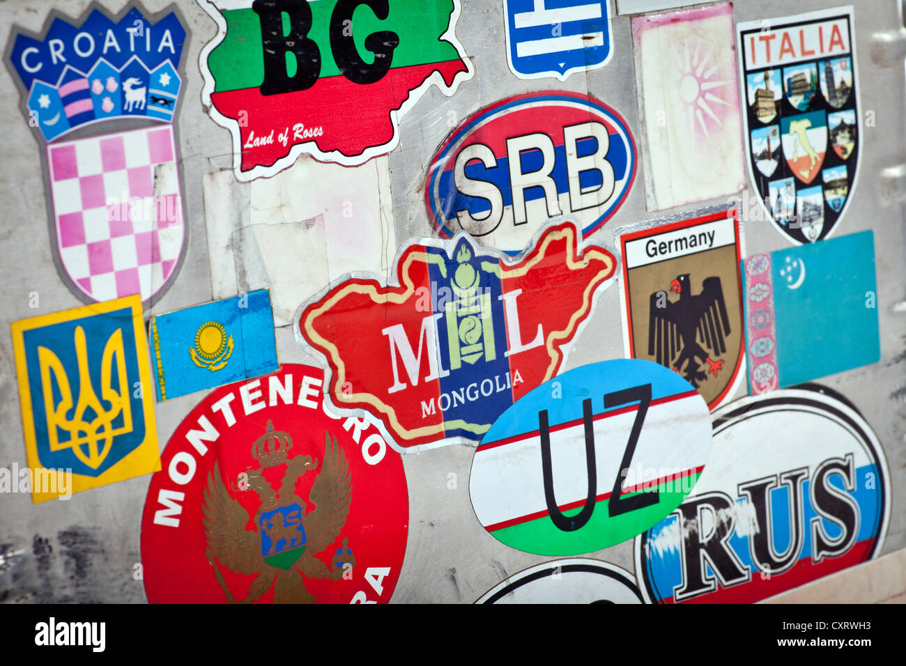 Country abbreviations stickers on a metal suitcase Stock Photo - Alamy
