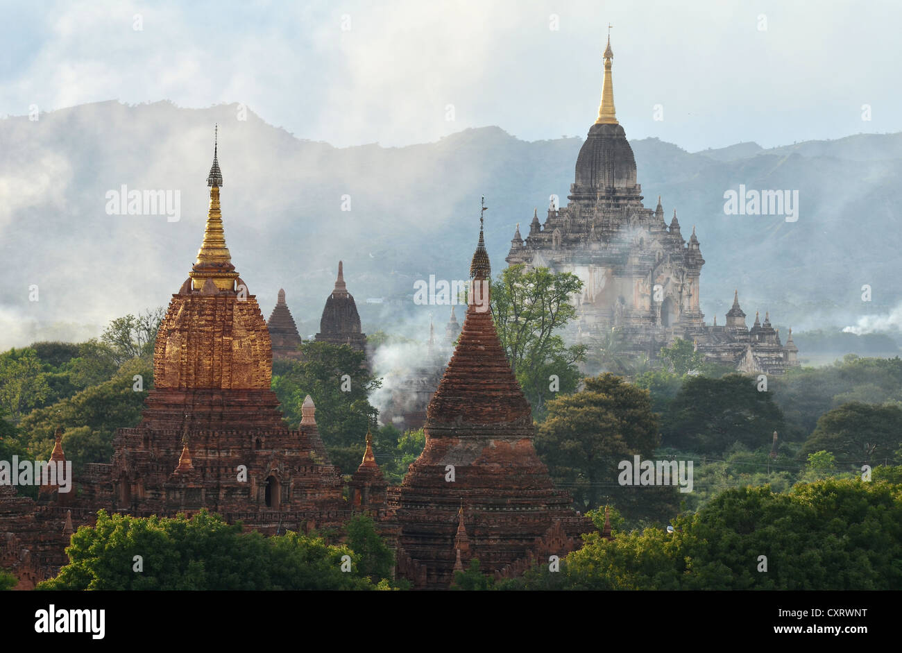 Smoke rising between the temples and pagodas in Bagan, Myanmar, Burma ...