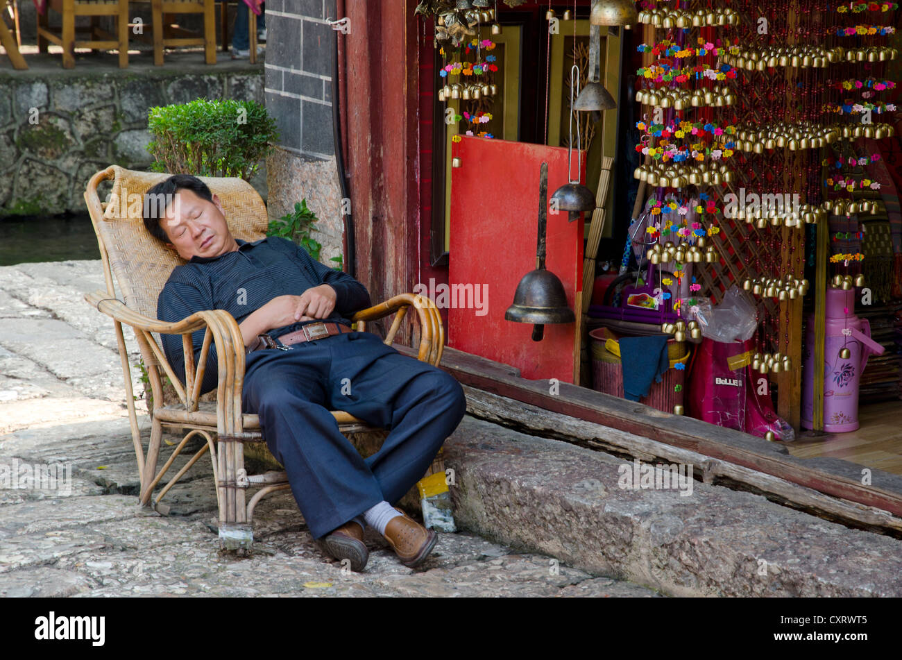 Asian man sleeping in chair hi-res stock photography and images - Alamy