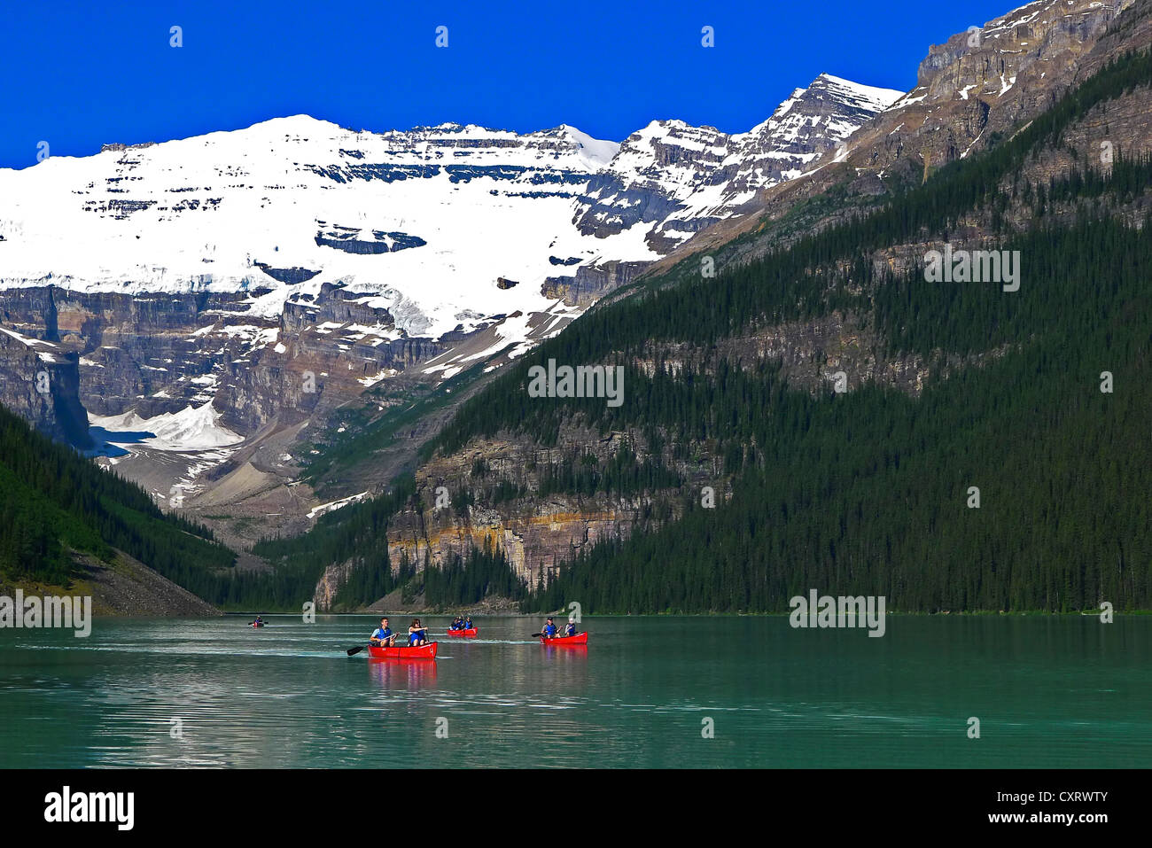 Lake Louise canoes with Victoria Glacier, Banff National Park, Alberta ...