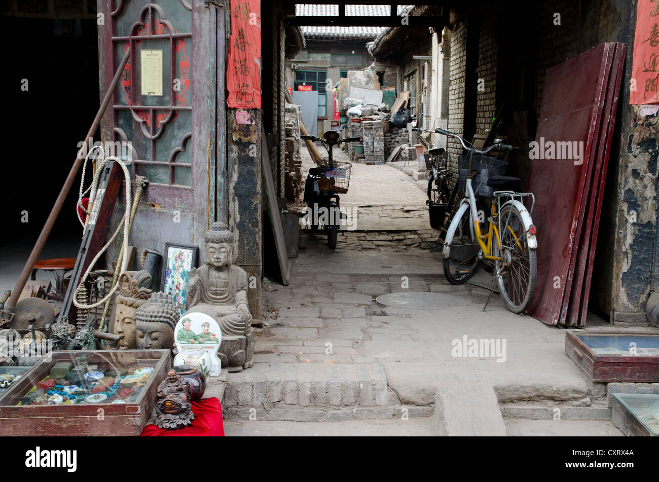Display of goods of a second-hand dealer, antique dealer, in front of ...