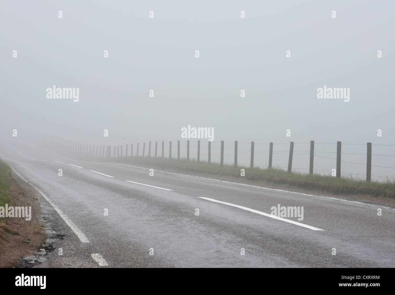 Dense fog on a road in the Scottish Highlands, Grampian Mountains ...