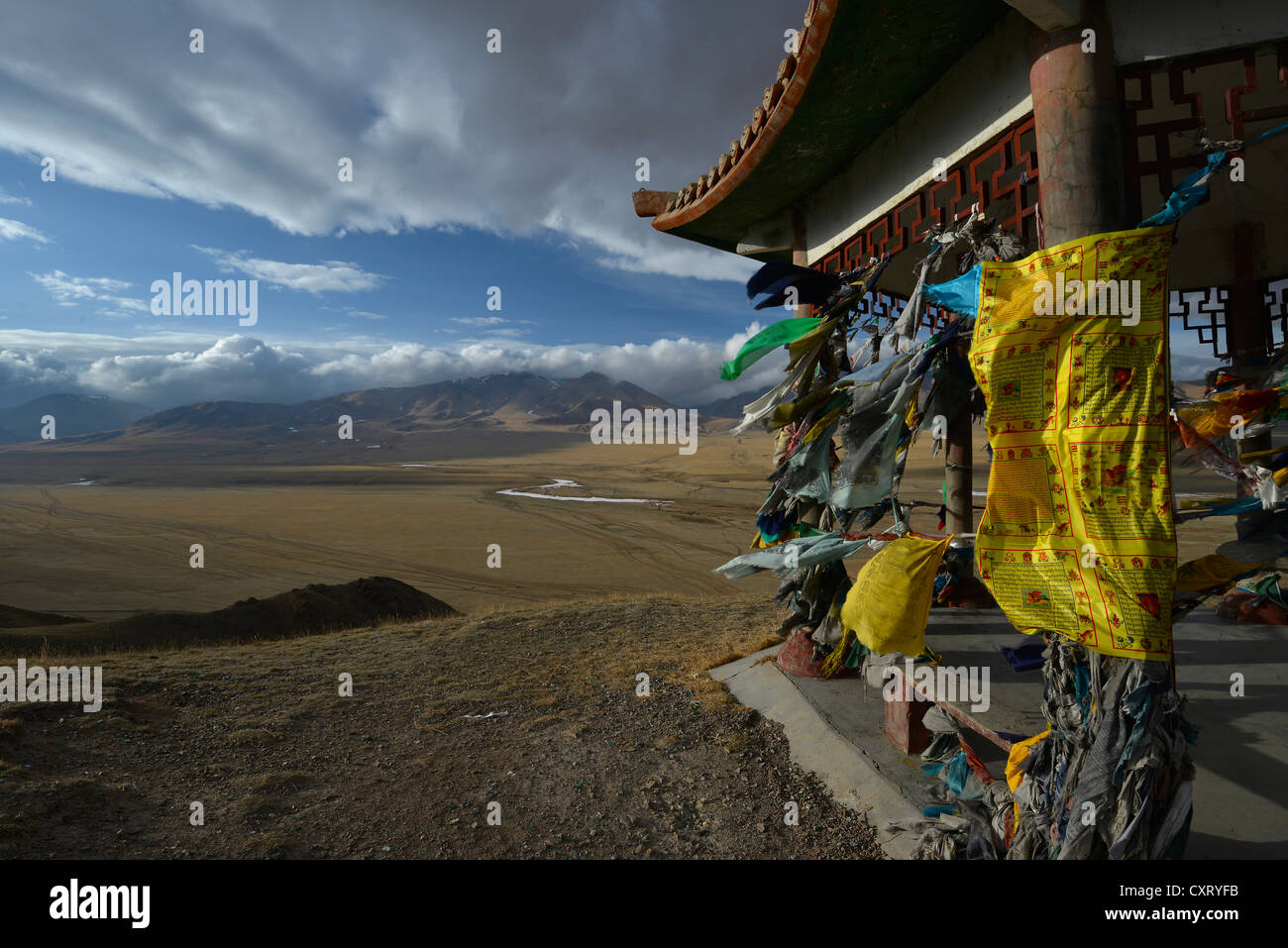 Chinese Mongolian pavilion adorned with Buddhist prayer flags flying in ...