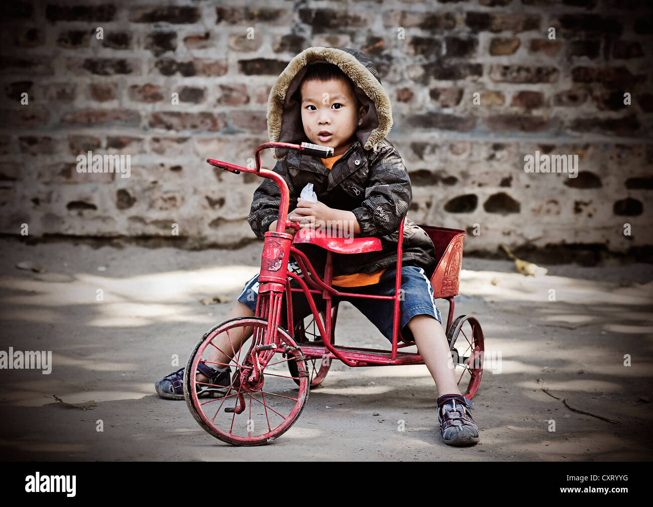 Boy Riding A Tricycle Stock Photos & Boy Riding A Tricycle Stock Images ...