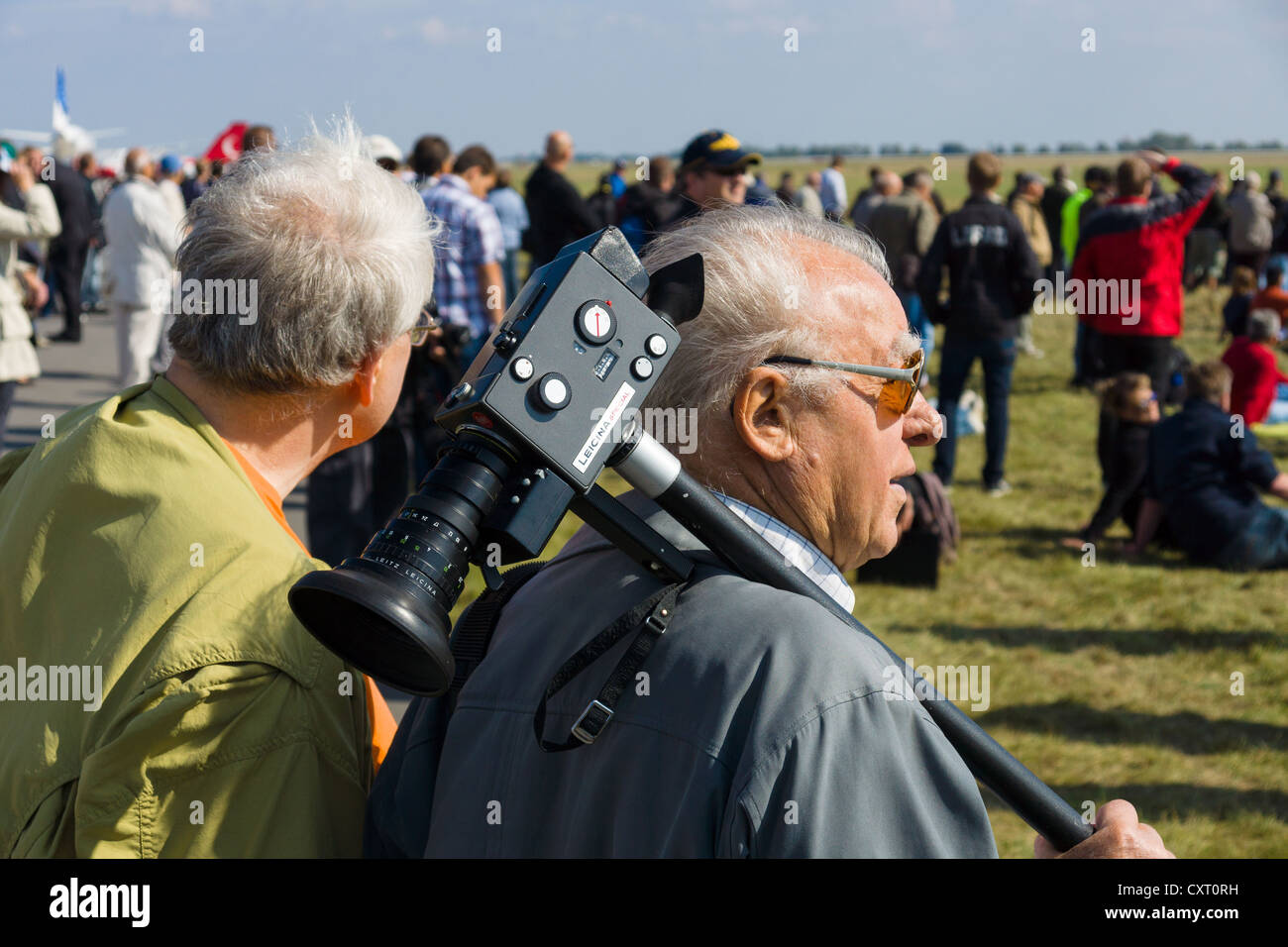 An elderly man with a movie camera Stock Photo - Alamy