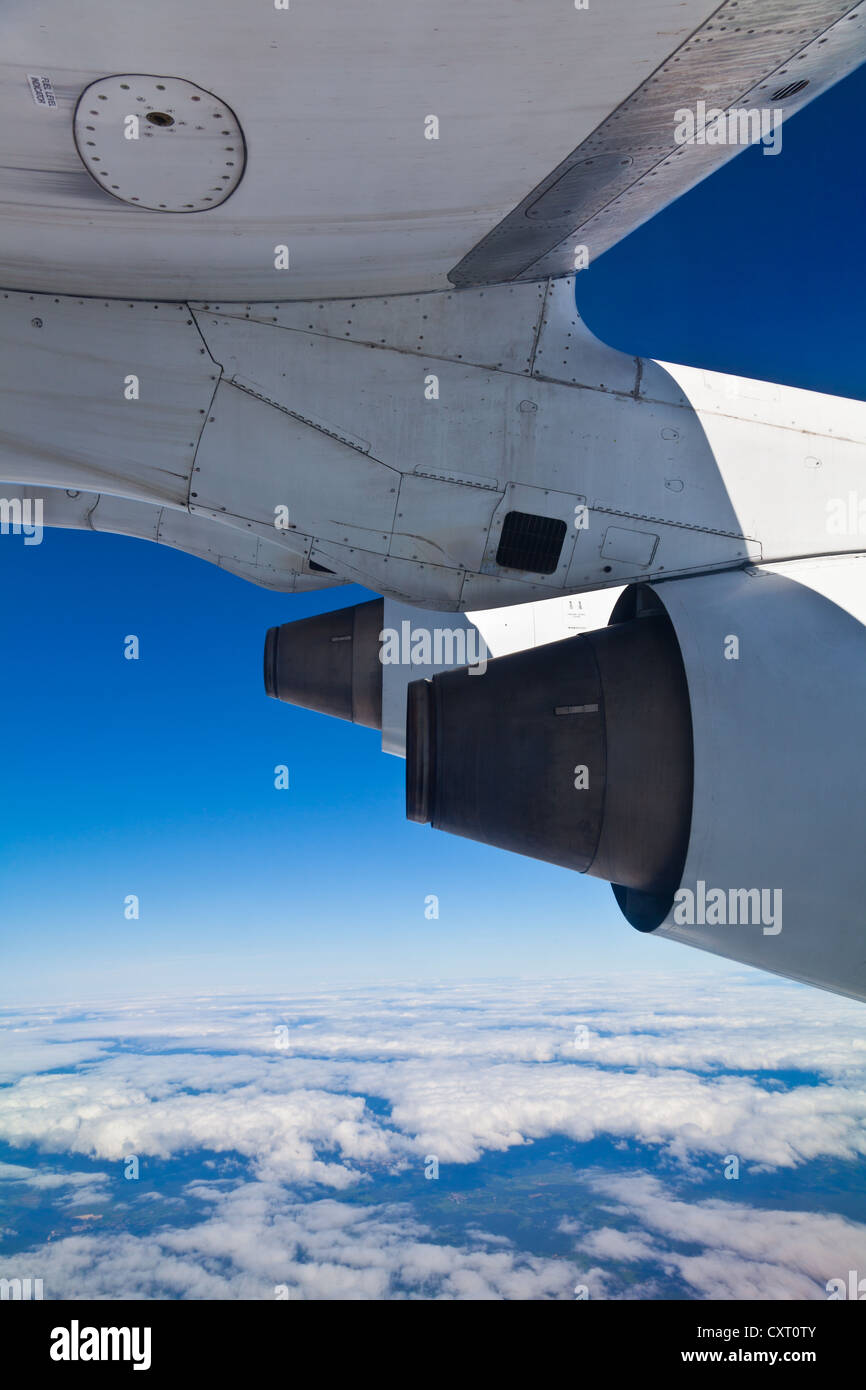Jet engines on an Avro RJ100 aircraft with clouds and a blue sky Stock ...