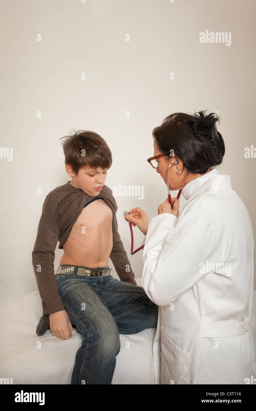 Boy getting an examination at the pediatrician's Stock Photo - Alamy