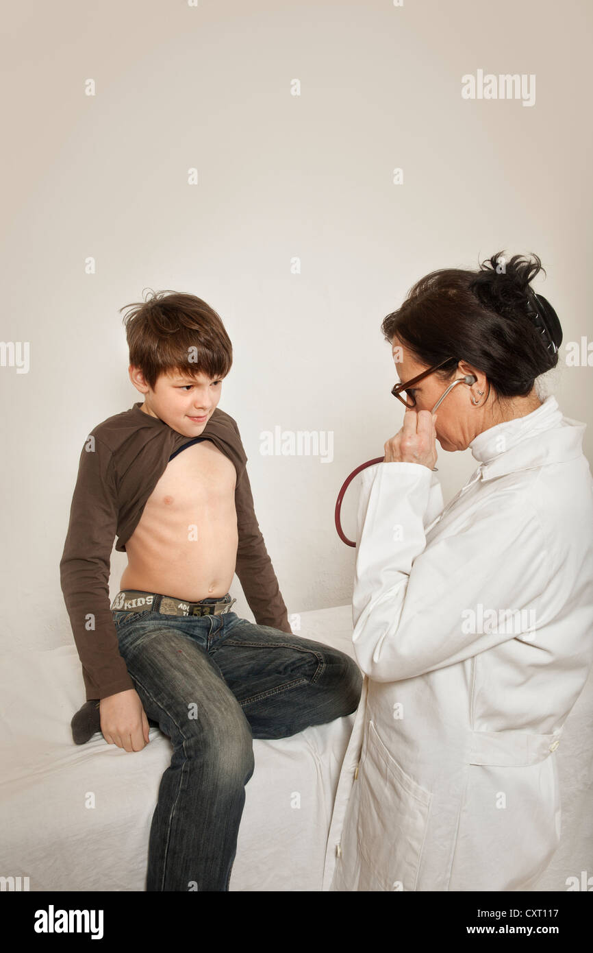 Boy getting an examination at the pediatrician's Stock Photo - Alamy
