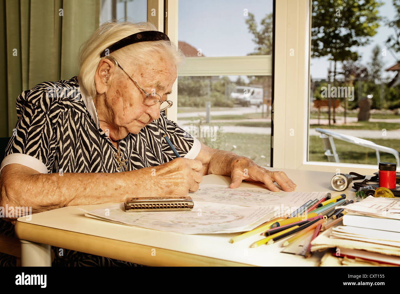 Old woman drawing Stock Photo - Alamy