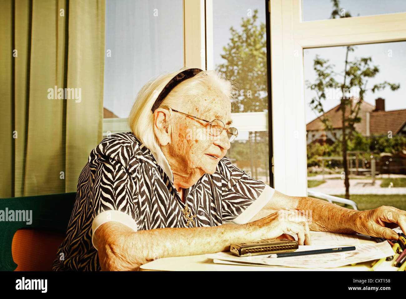 Old woman drawing Stock Photo - Alamy