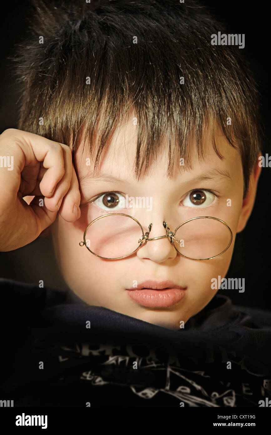 Boy wearing metal-rimmed glasses Stock Photo - Alamy