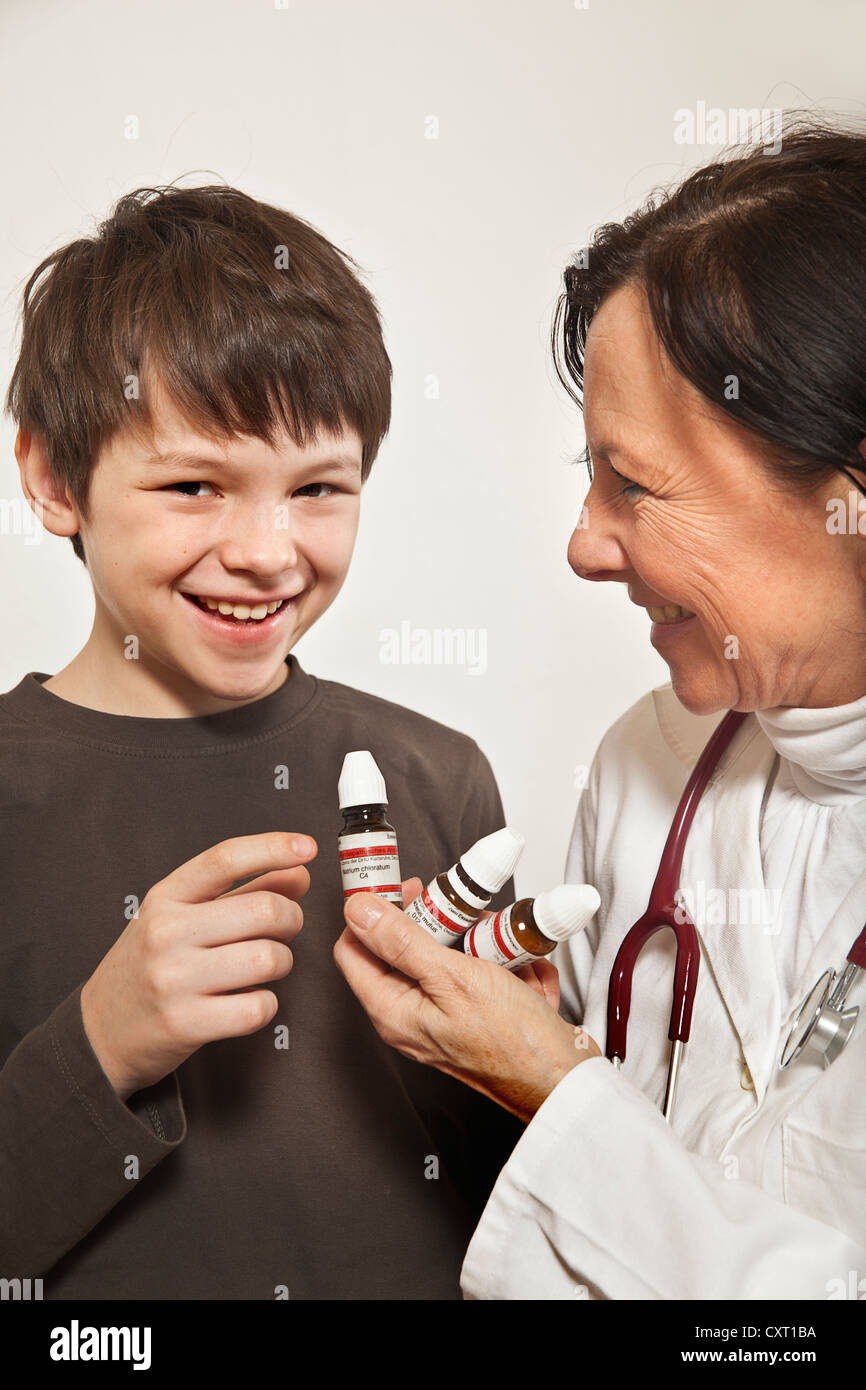 Kids given medicine hi-res stock photography and images - Alamy