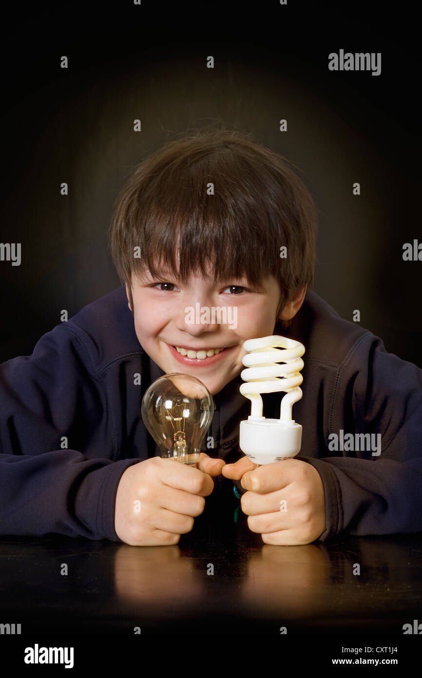 Child holding a light bulb hi-res stock photography and images - Alamy