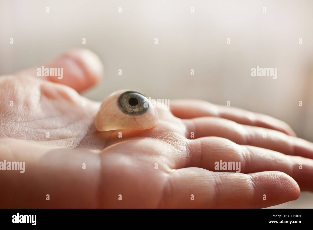 Prosthetic eye on a hand Stock Photo - Alamy