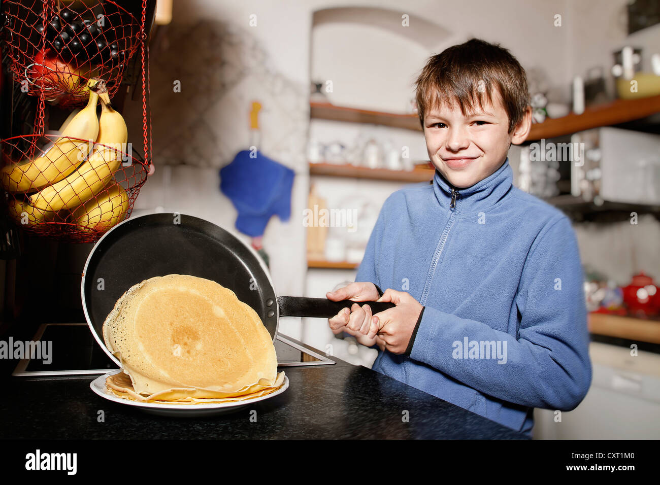 Boy making Palatschinken, pancakes Stock Photo - Alamy
