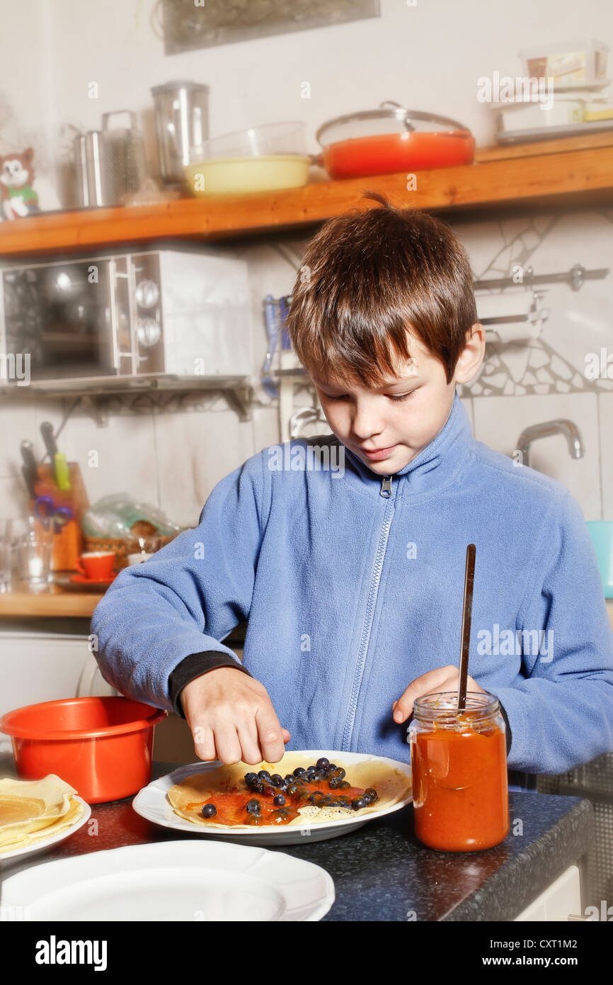 Boy making Palatschinken, pancakes Stock Photo - Alamy