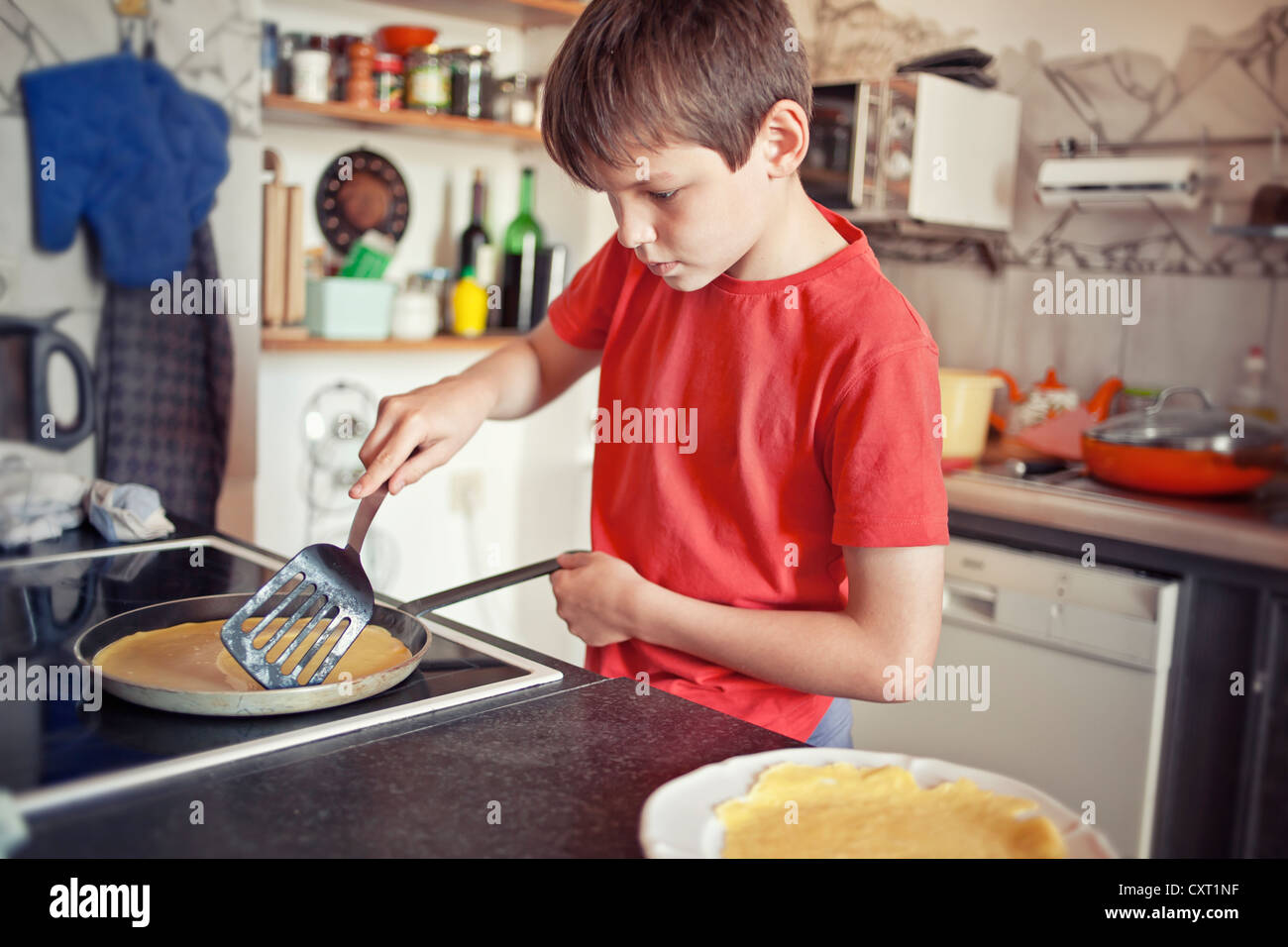 Boy making Palatschinken, pancakes Stock Photo - Alamy