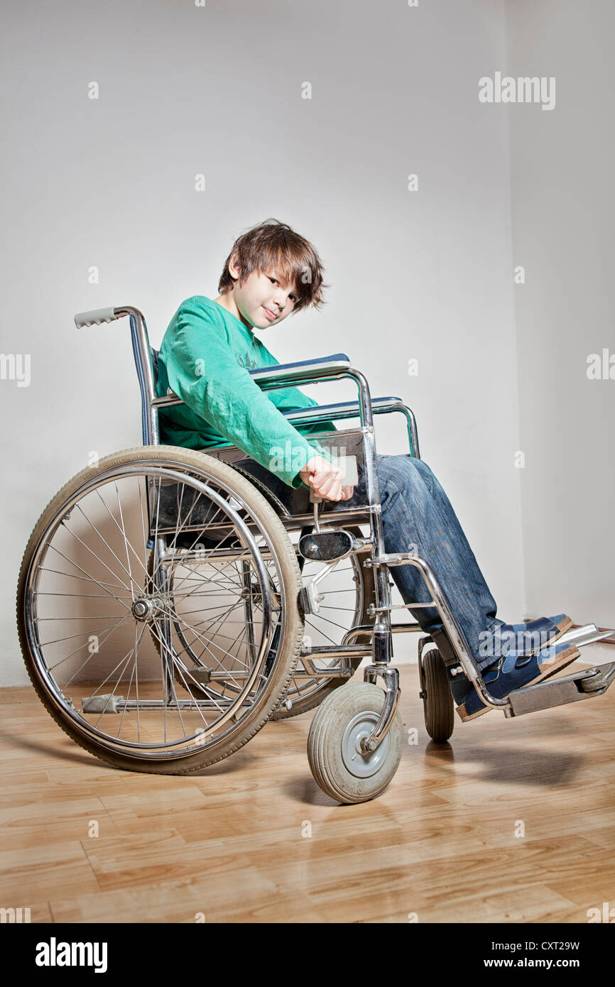 Wheelchair wheel chair handicap boy hi-res stock photography and images ...