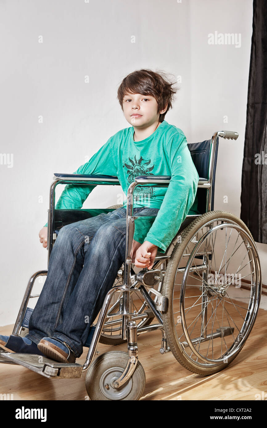 Boy in a wheelchair Stock Photo - Alamy