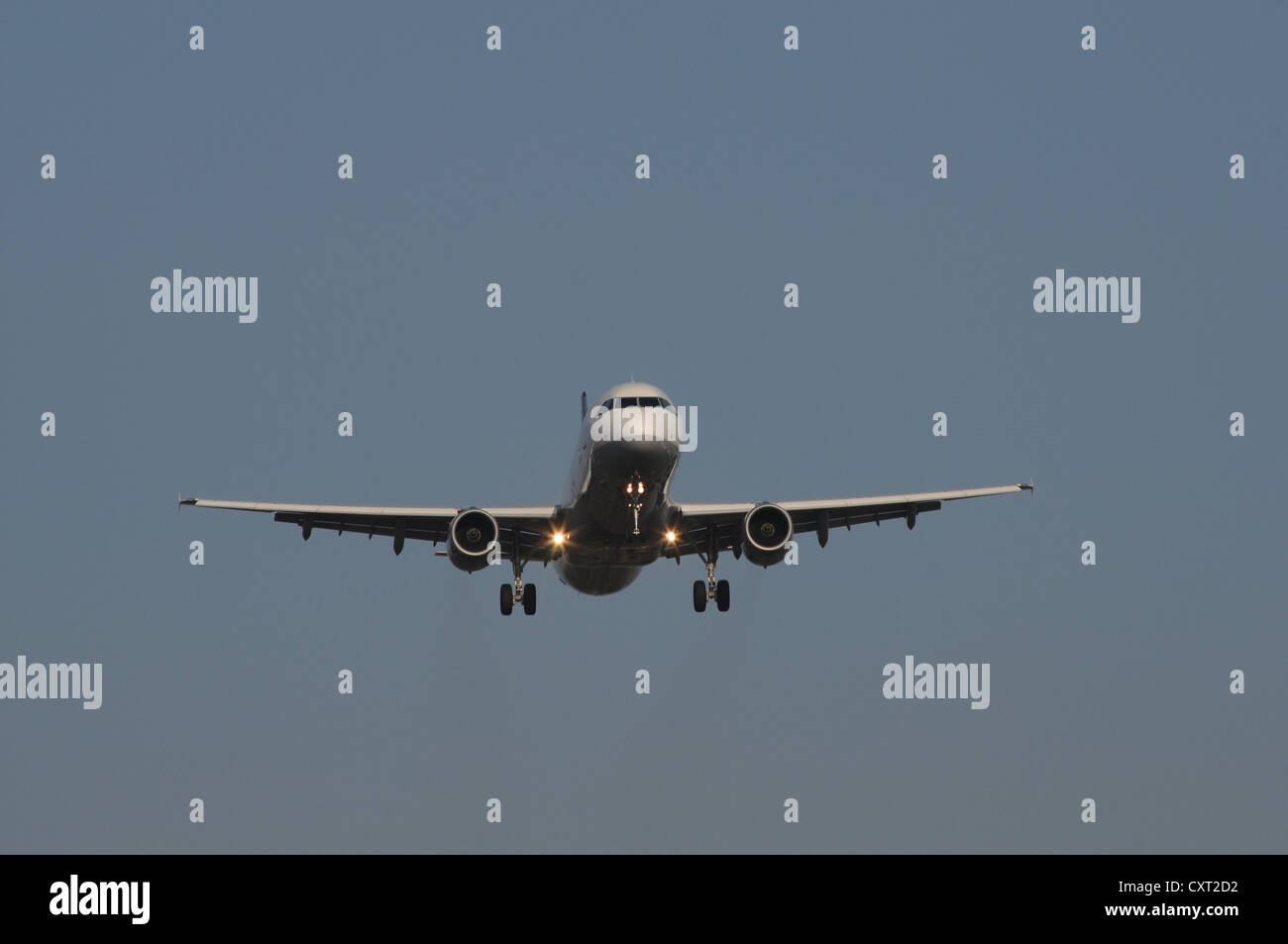 Passenger aircraft during landing approach, from below Stock Photo - Alamy