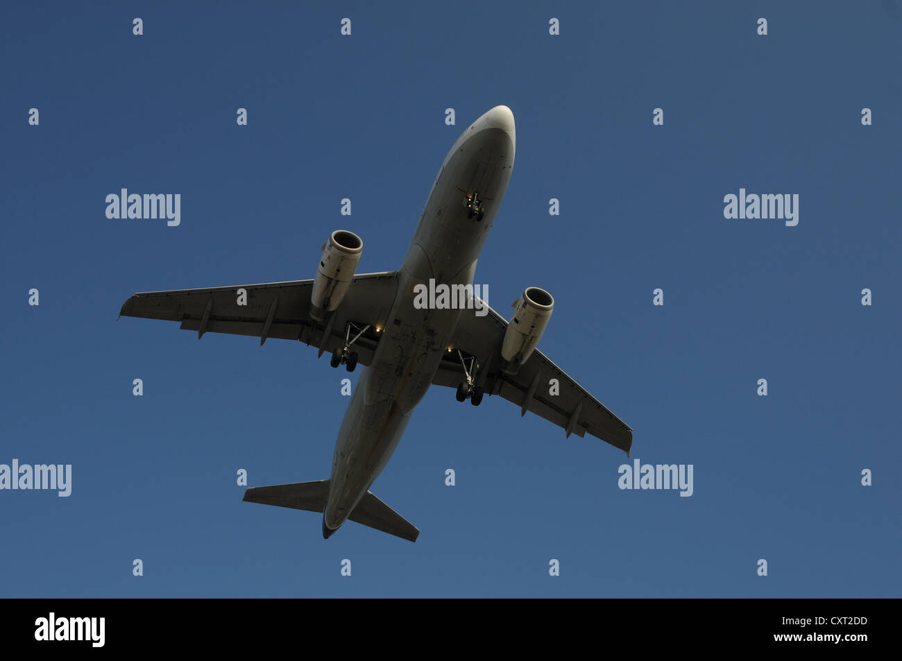 Passenger aircraft during landing approach, from below Stock Photo - Alamy