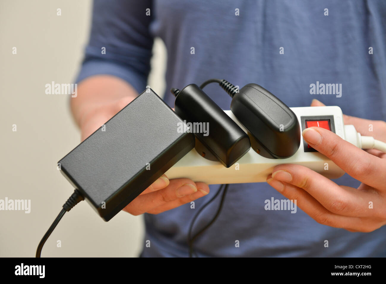 Power adapters in a switchable power outlet Stock Photo - Alamy