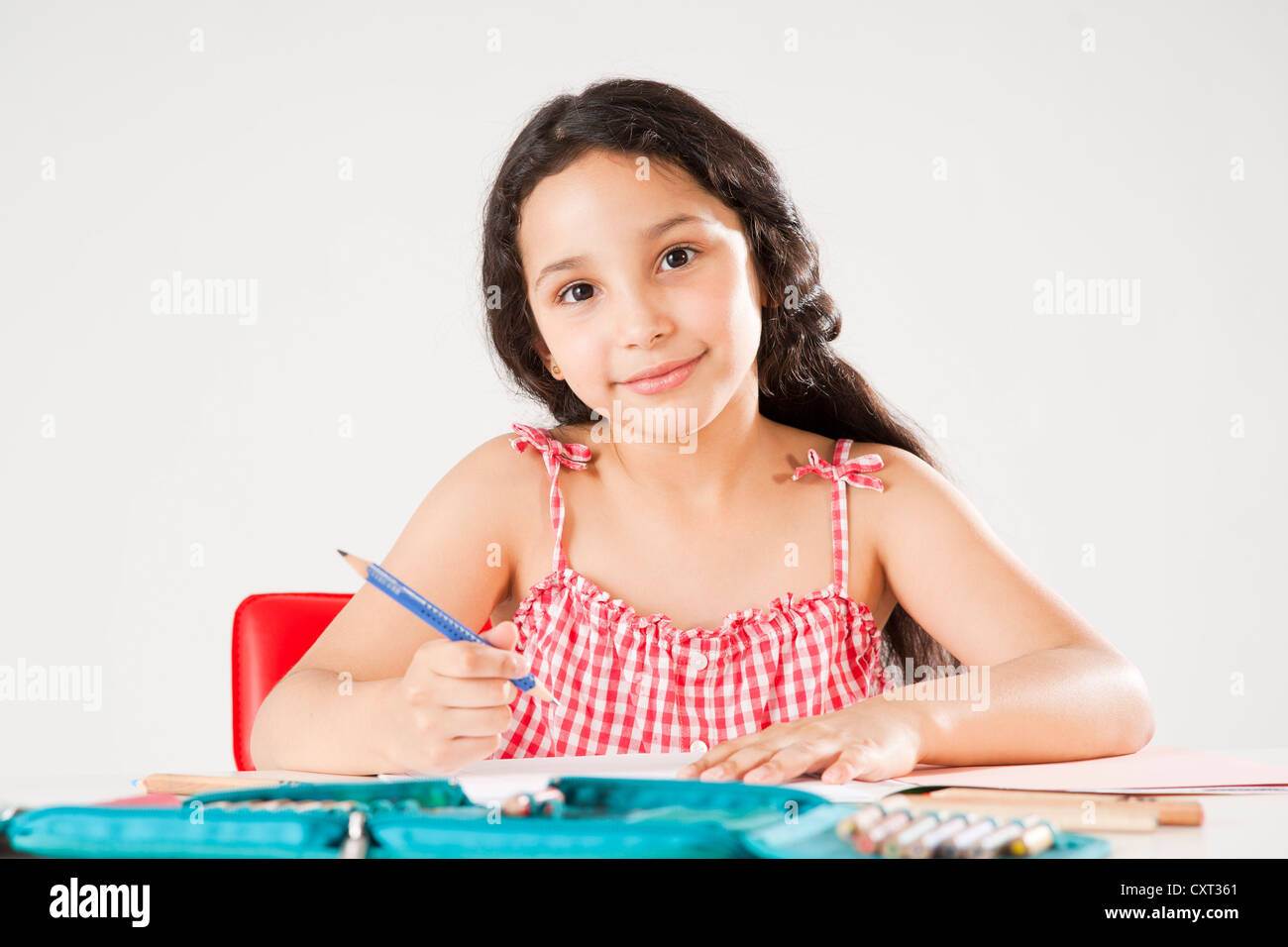 Girl doing her homework, learning Stock Photo - Alamy