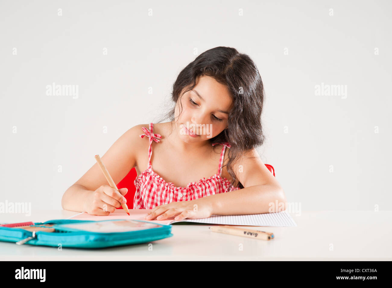 Girl doing her homework, learning Stock Photo - Alamy