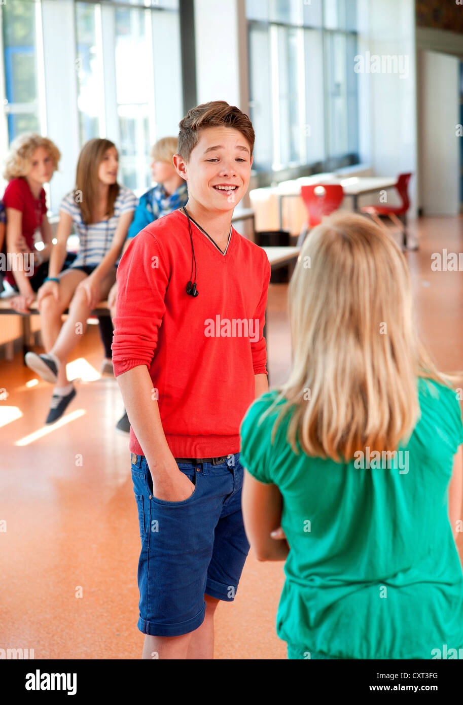 Teenage couple flirting at school Stock Photo - Alamy