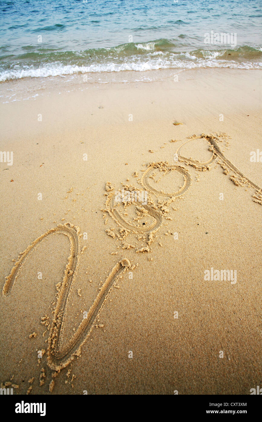 Words Written in the Sand With Wave Stock Photo - Alamy