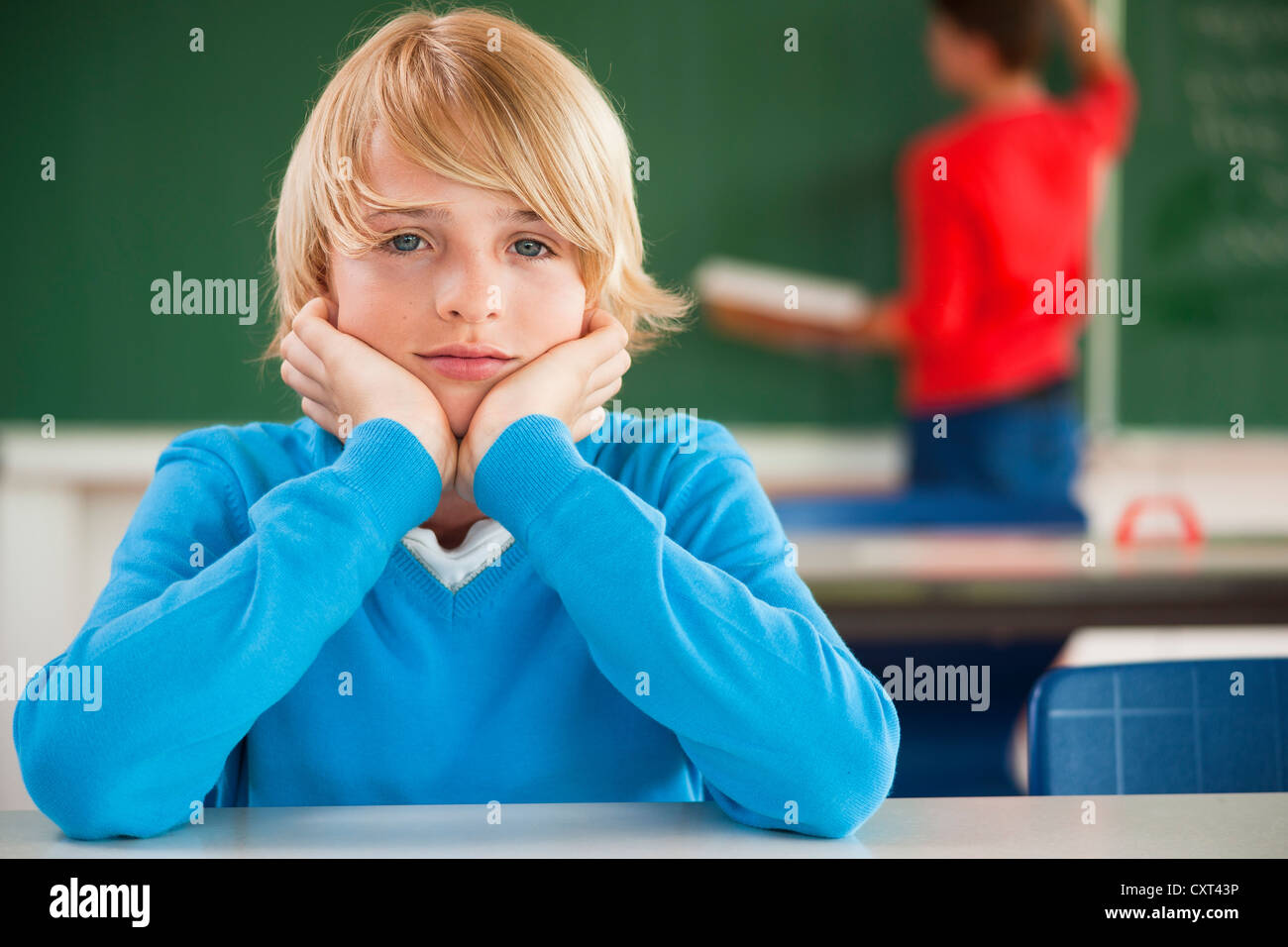 Schoolboy in a classroom, portrait Stock Photo - Alamy