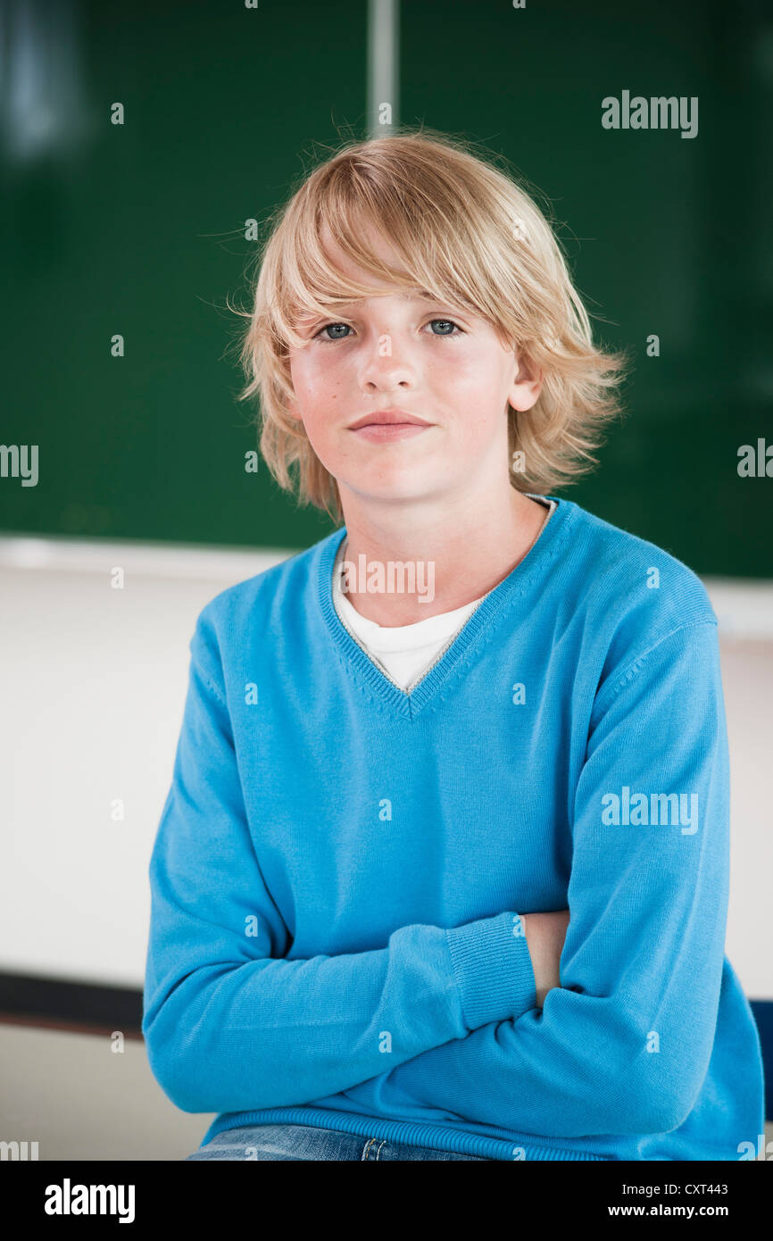 Schoolboy in a classroom, portrait Stock Photo - Alamy