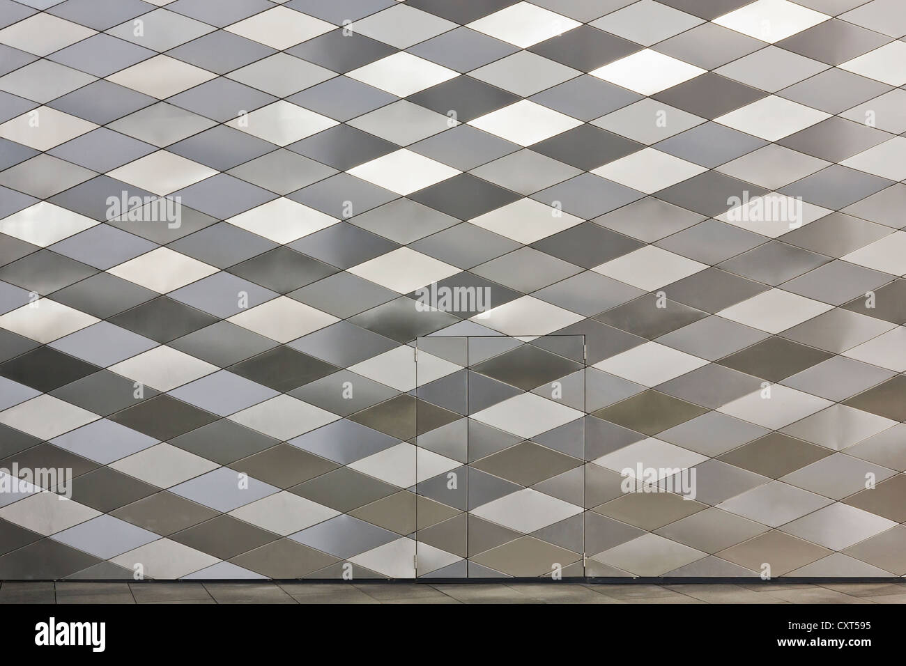 Wall and the front door of the metal silver diamond-shaped panels ...