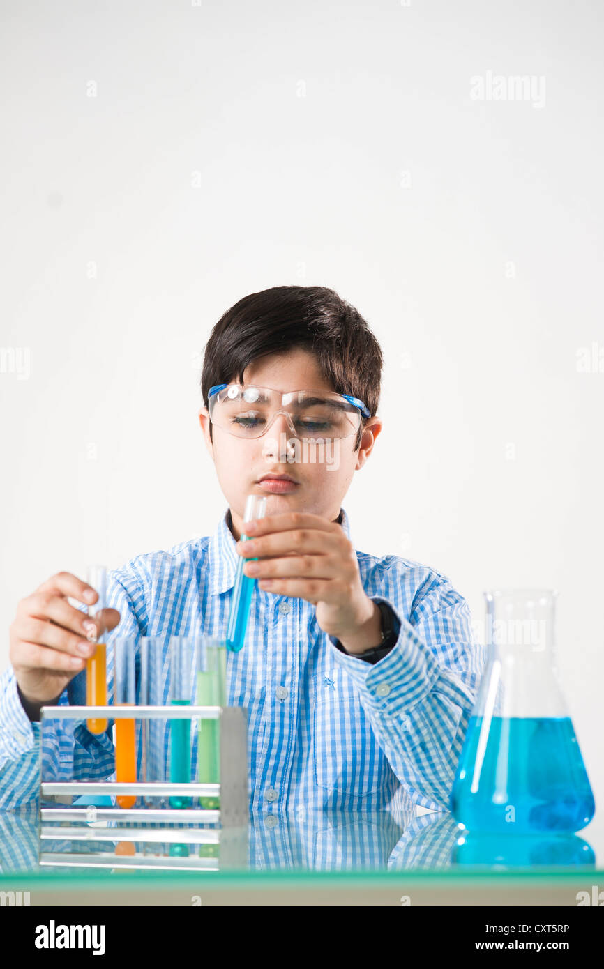 Boy holding test tubes Stock Photo - Alamy