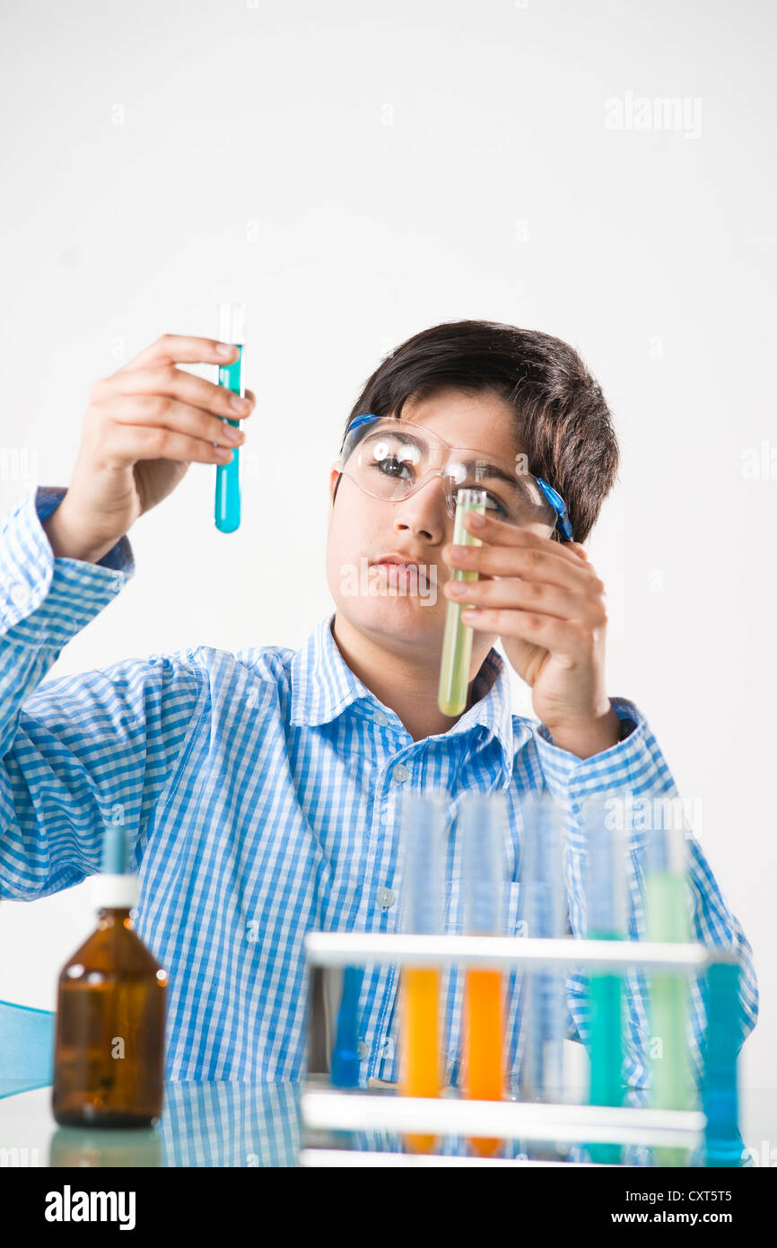 Boy holding test tubes Stock Photo - Alamy
