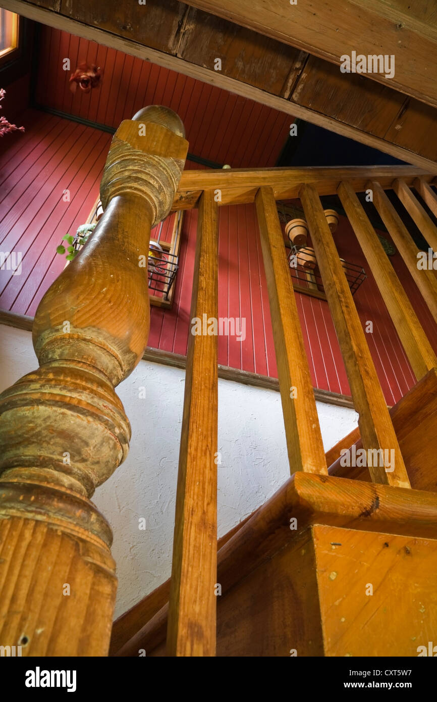 Close-up of the baluster and railings in an old wooden staircase in an ...