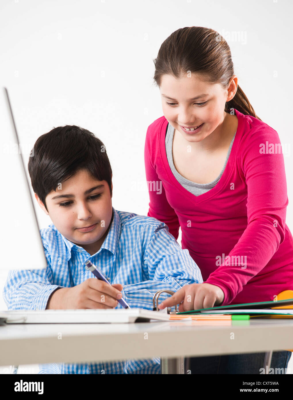 Girl explaining job to a boy Stock Photo - Alamy