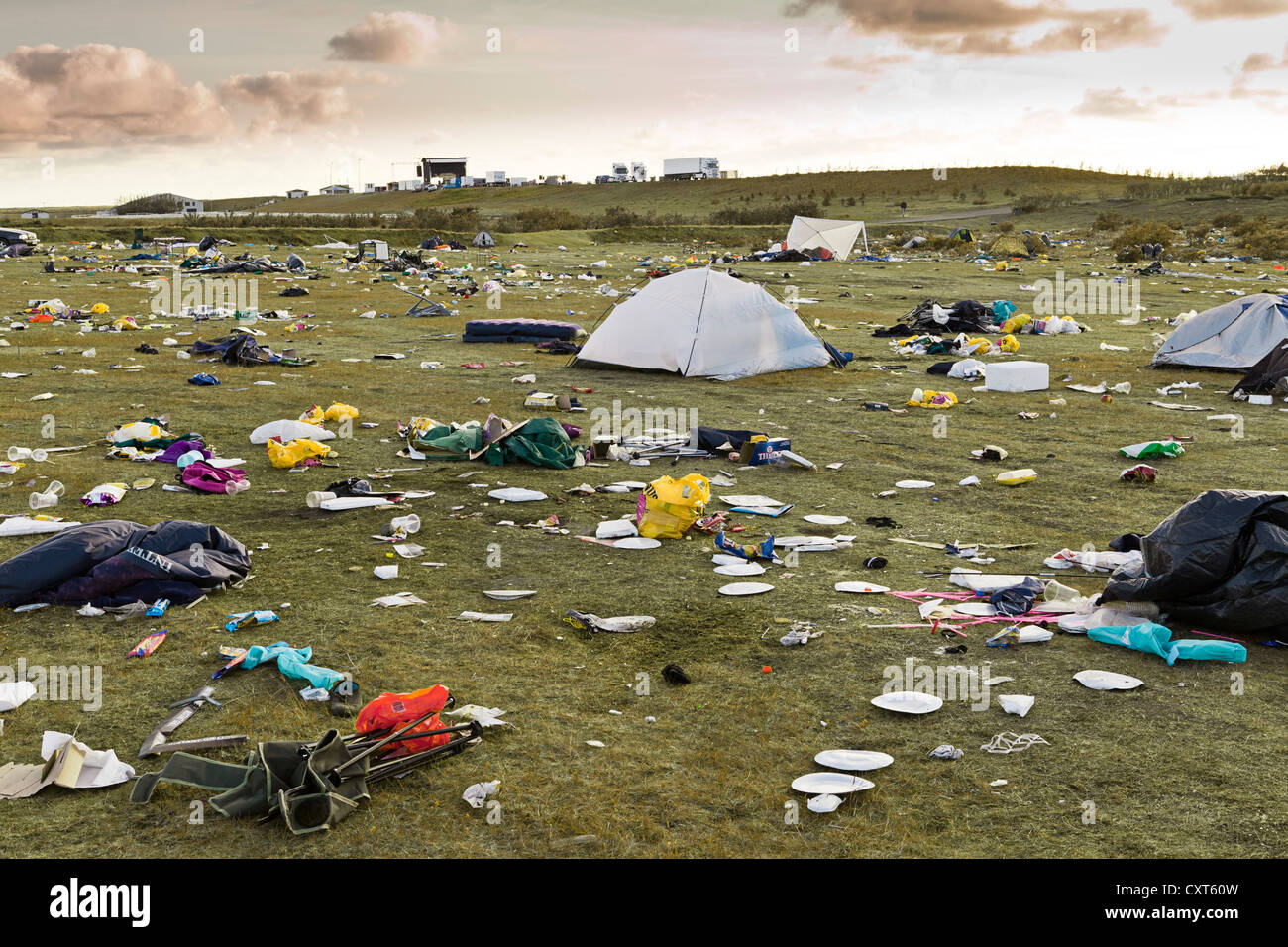 Meadow full of garbage, waste, destroyed tents and broken camping ...