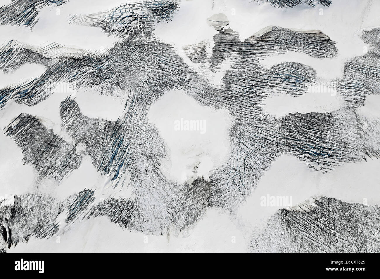 Aerial view, lines and ice crevices in the ice and snow of the ...